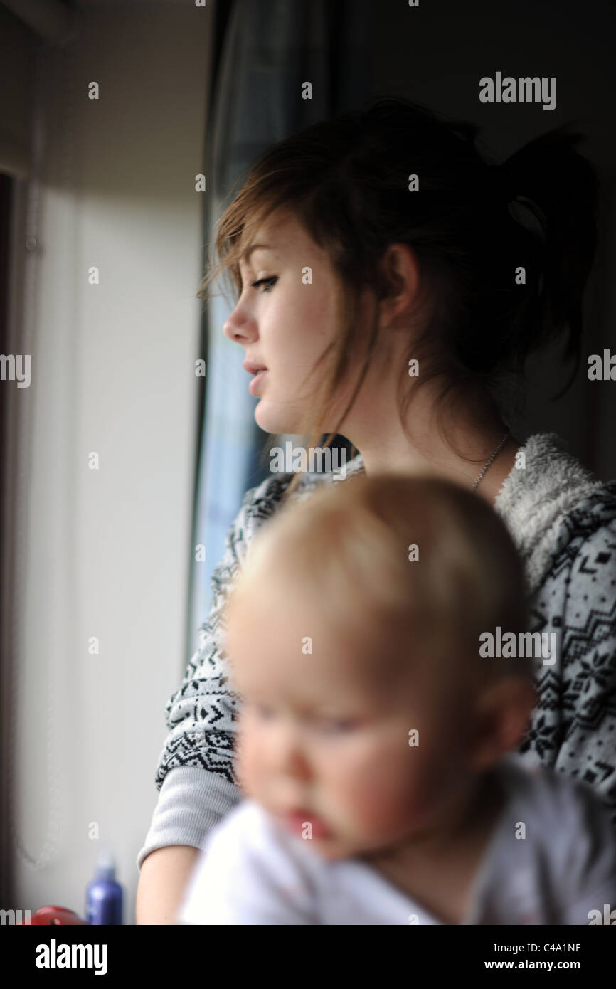 Teen Mother Holding a Baby Stock Photo - Alamy