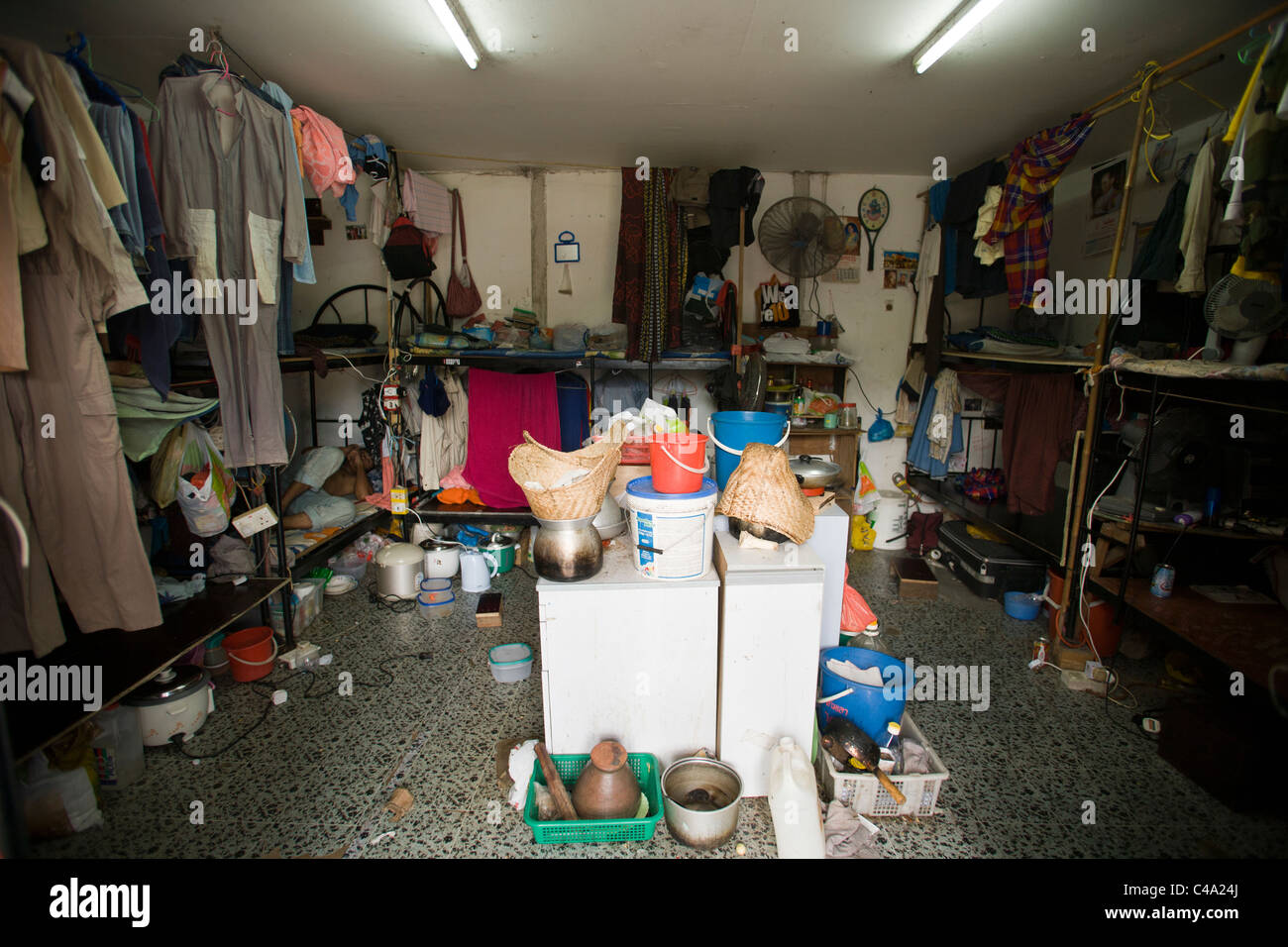 A foreign worker Inside a room in a dormitory for foreign workers in ...