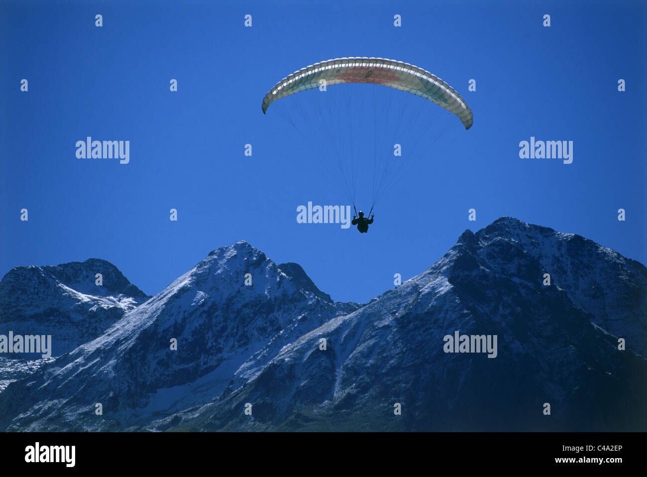 Photograph of a free fall parachute at the mountains of Switzerland ...