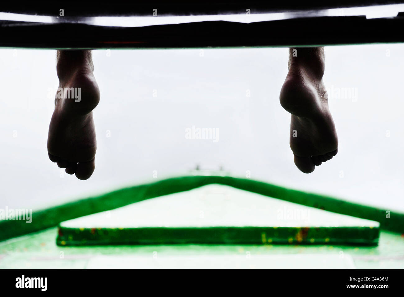 Hanging from feet hi-res stock photography and images - Alamy