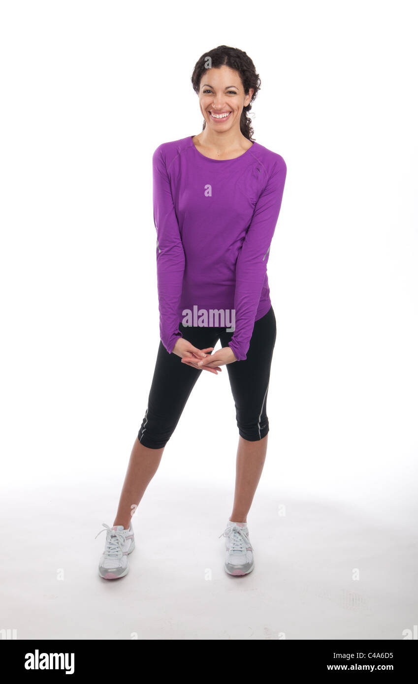 Young black woman runner athlete standing strong against white studio ...