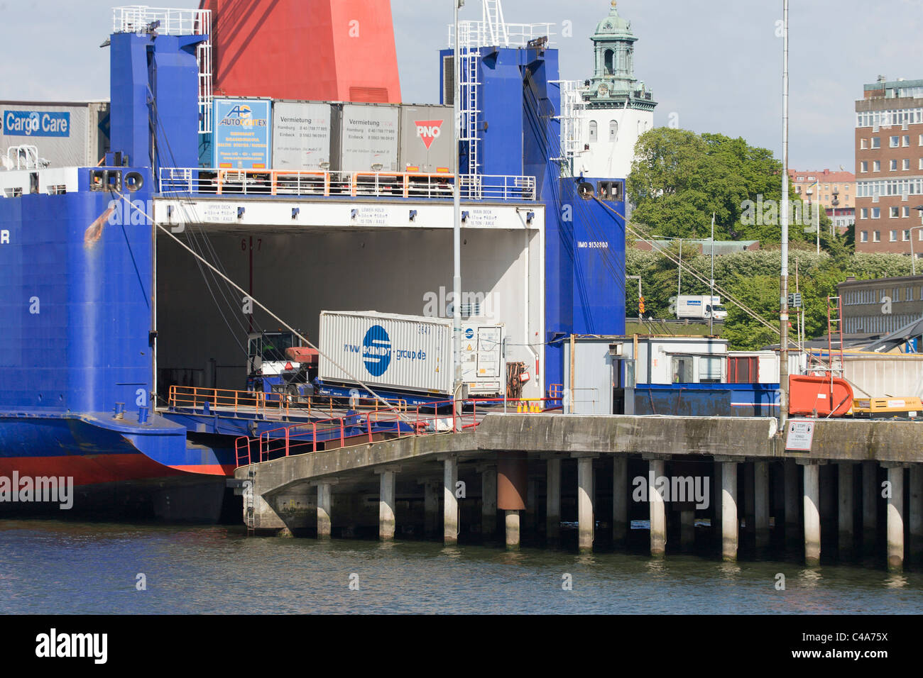 Loading the ferry in the port Stock Photo - Alamy