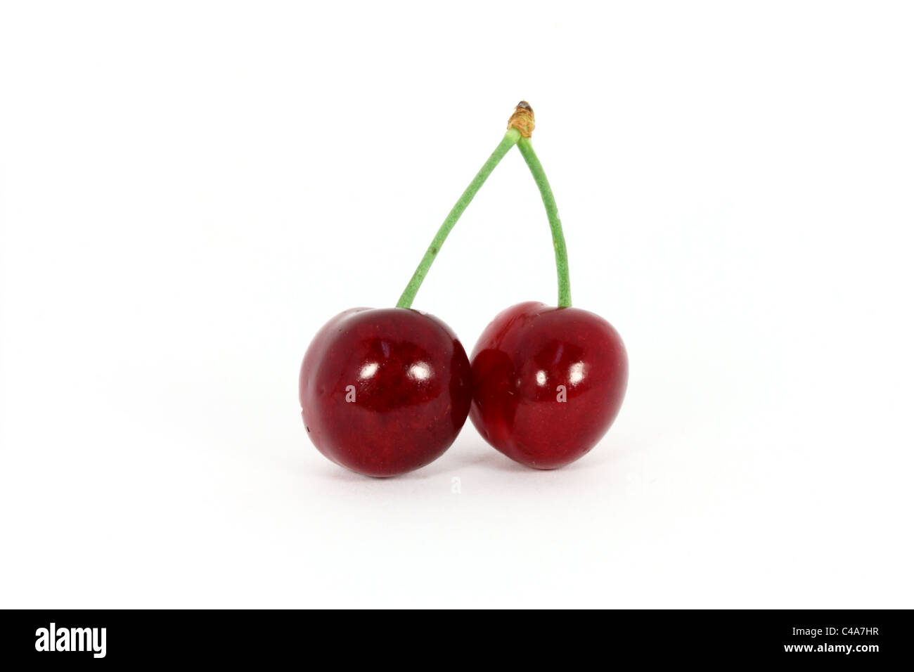 Two sweet cherries isolated on white background Stock Photo - Alamy