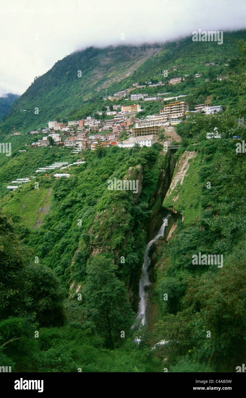 Photograph of a small Tibatian town on the slope of a mountain in Tibet ...