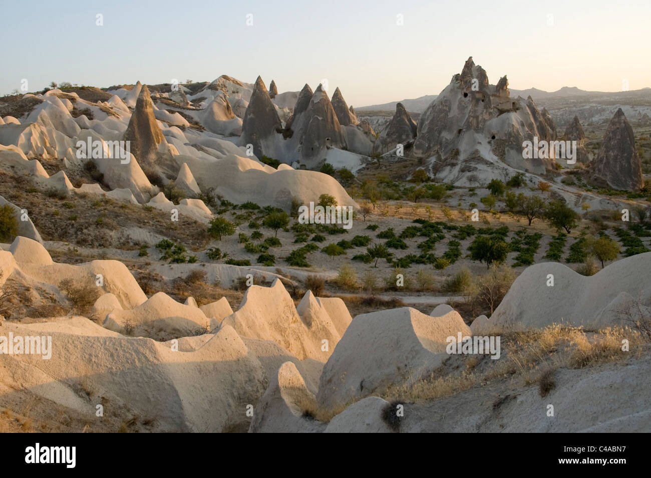 Photograph of the Kapadokya's pillars in Turkey at sunrise Stock Photo ...