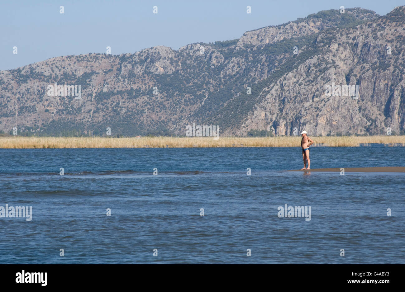 Photograph of a man standing on the beach in Turkey Stock Photo - Alamy