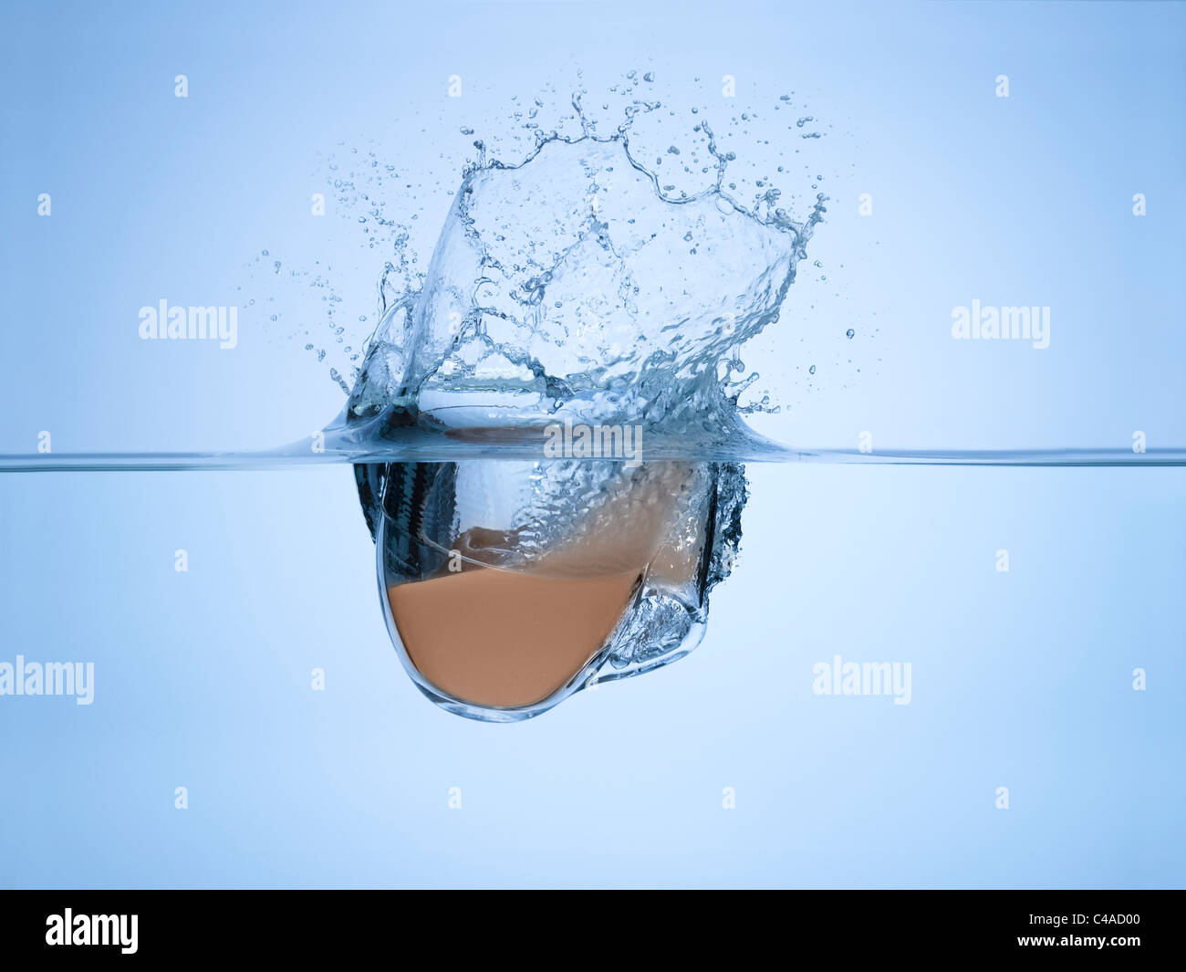 A cup of tea dropped in some water Stock Photo - Alamy