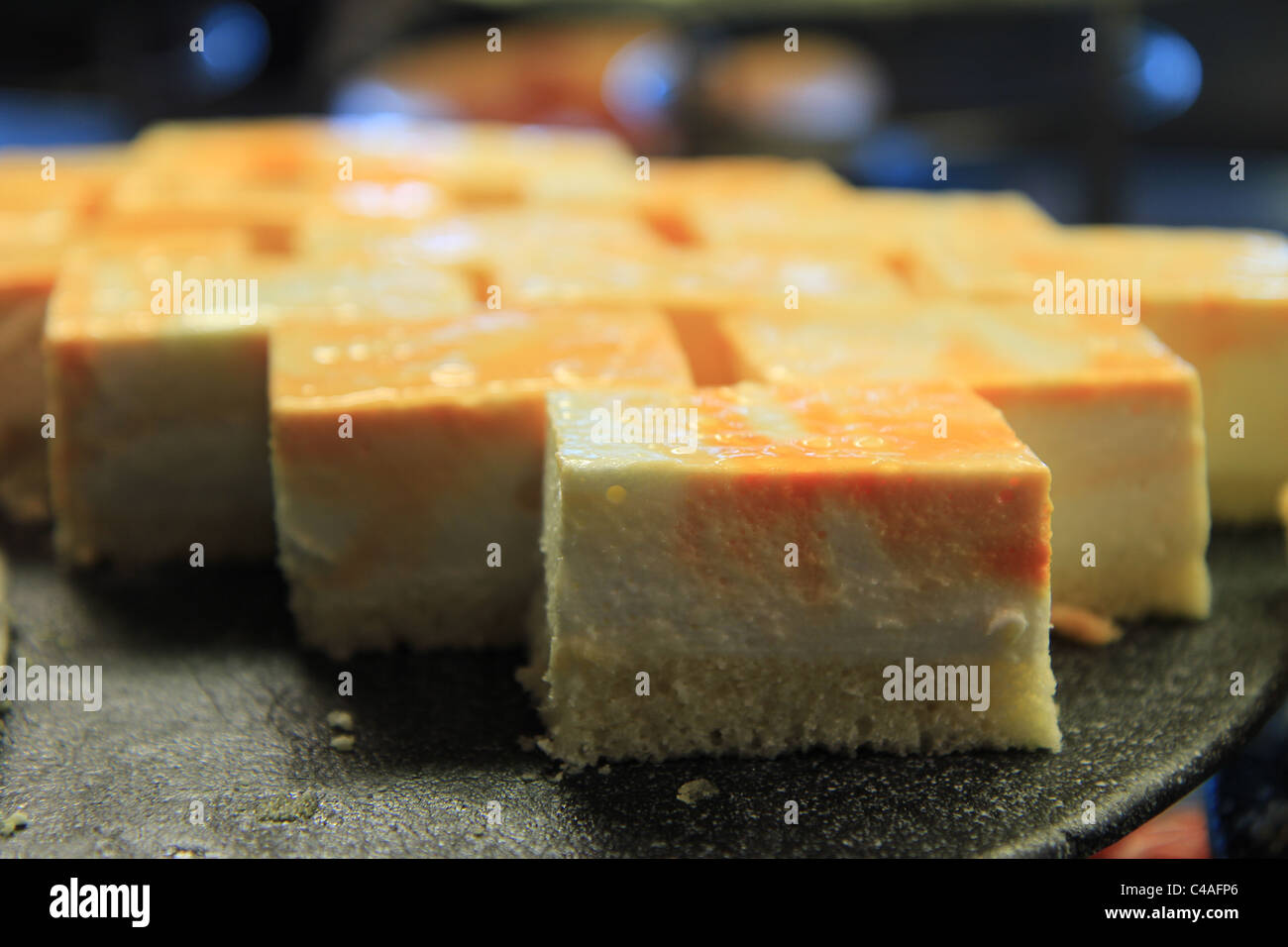 Cheese cake displayed at food buffet Stock Photo - Alamy