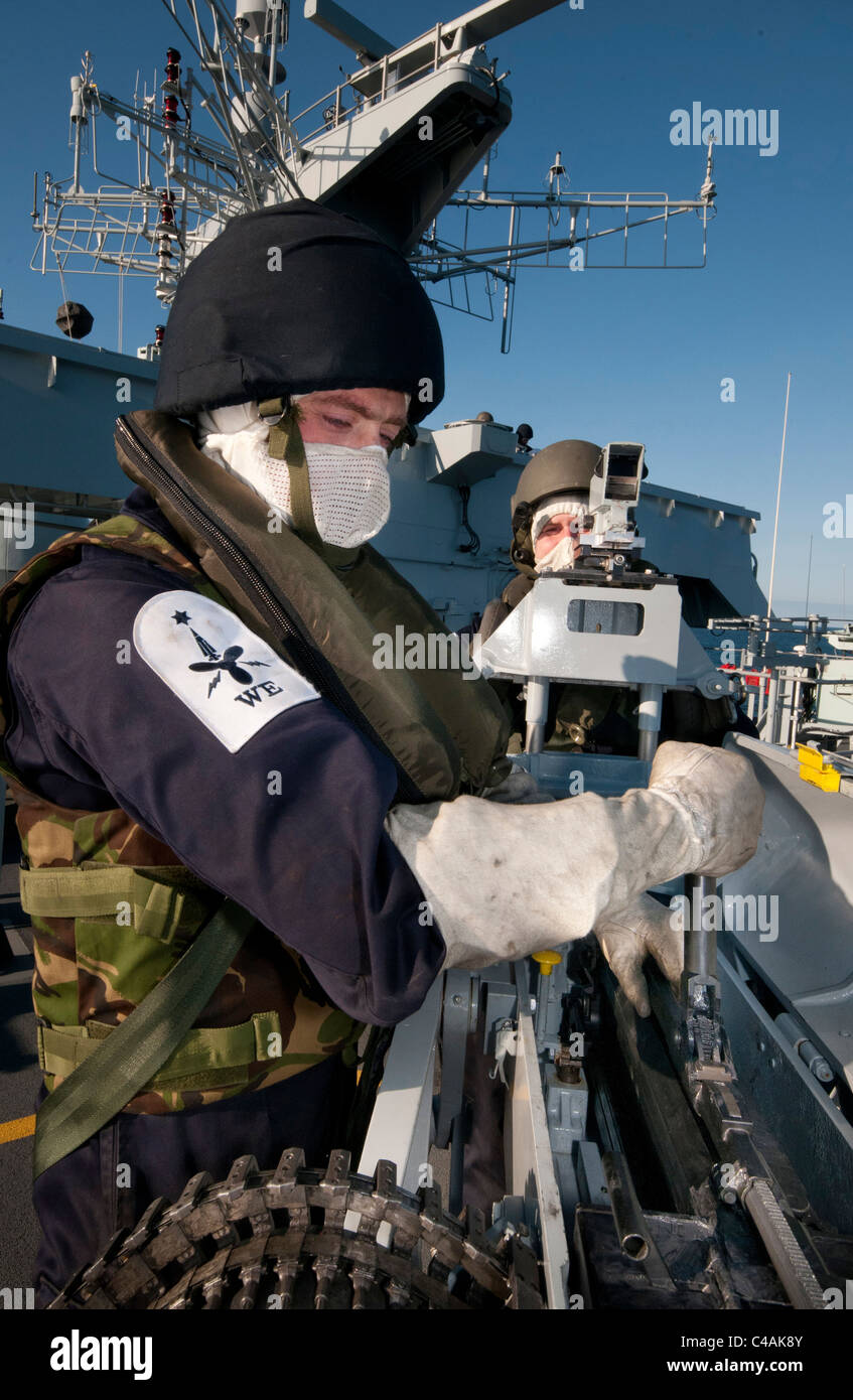 A gun crew on the Royal Navy assault ship HMS Bulwark preparing a 20mm ...