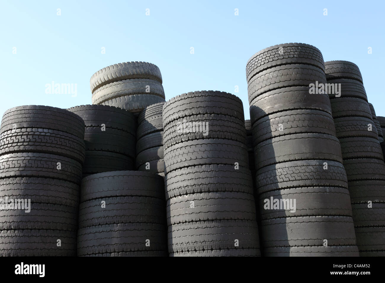 Pile of old tires for recycling Stock Photo - Alamy