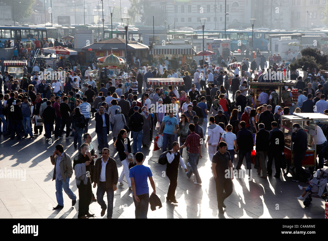 Crowds of people at sunset on the harbour waterfront in Istanbul ...