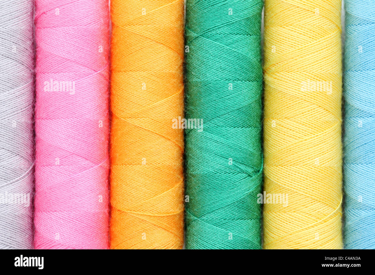 Colorful spools of thread, background texture Stock Photo - Alamy