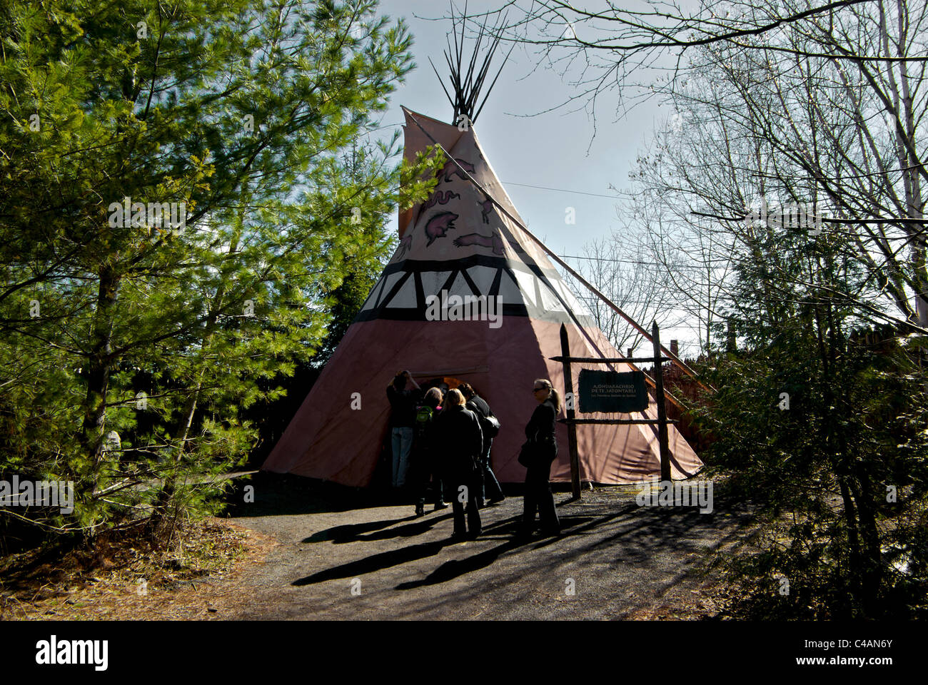 High school students teachers tour group entering tepee Huron-Wendat ...