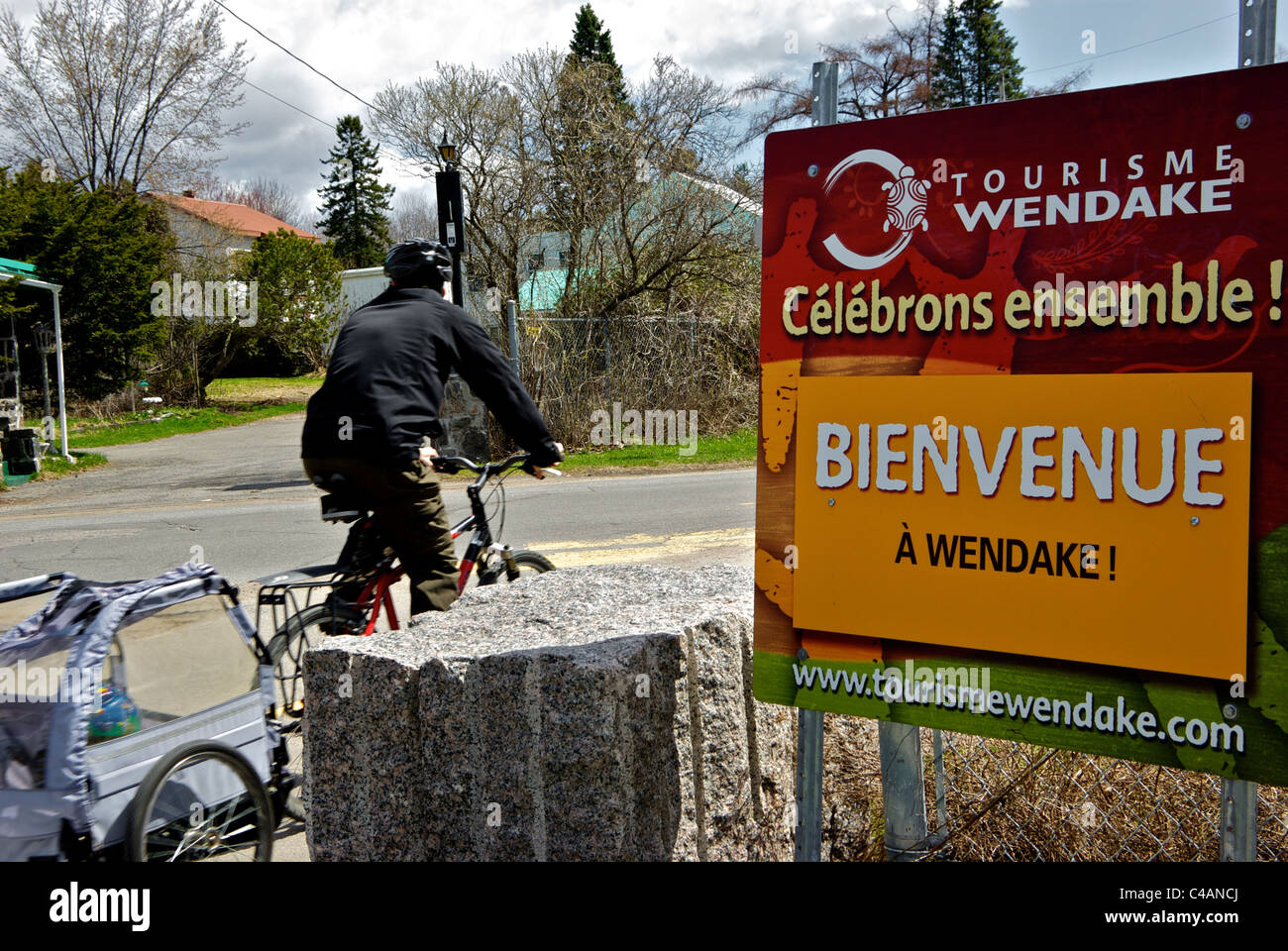 Bicycle rider child trailer in motion blur on cycle path passing ...