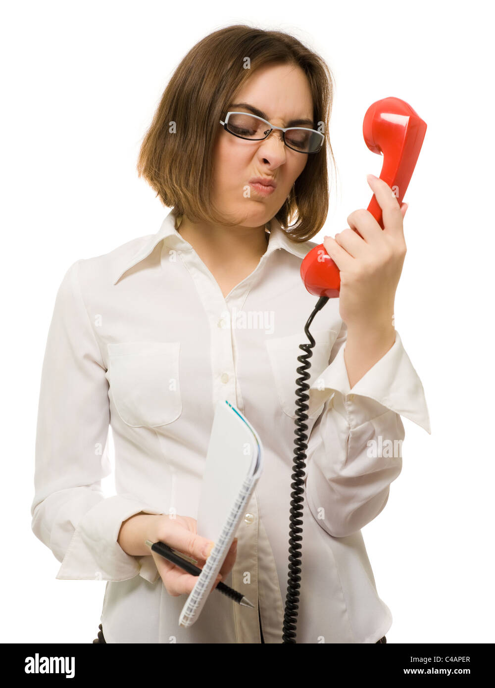 Young secretary wincing to read headset Stock Photo - Alamy