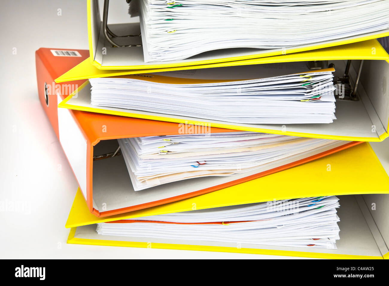 yellow and orange file folders stacked on each other Stock Photo - Alamy