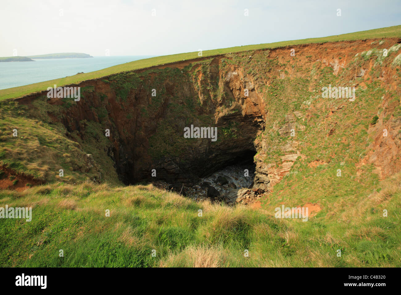 Trevone Bay Round Hole caused by a collapsed sea cave, North Cornwall ...