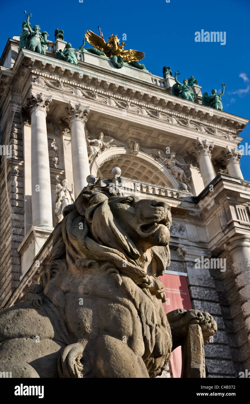 stone lion sculpture guarding vienna's national library Stock Photo - Alamy