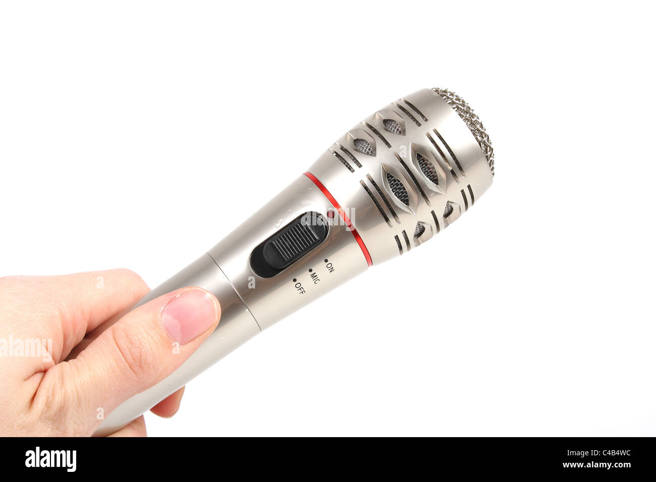 A Caucasian female holding a silver microphone on a cut out white ...