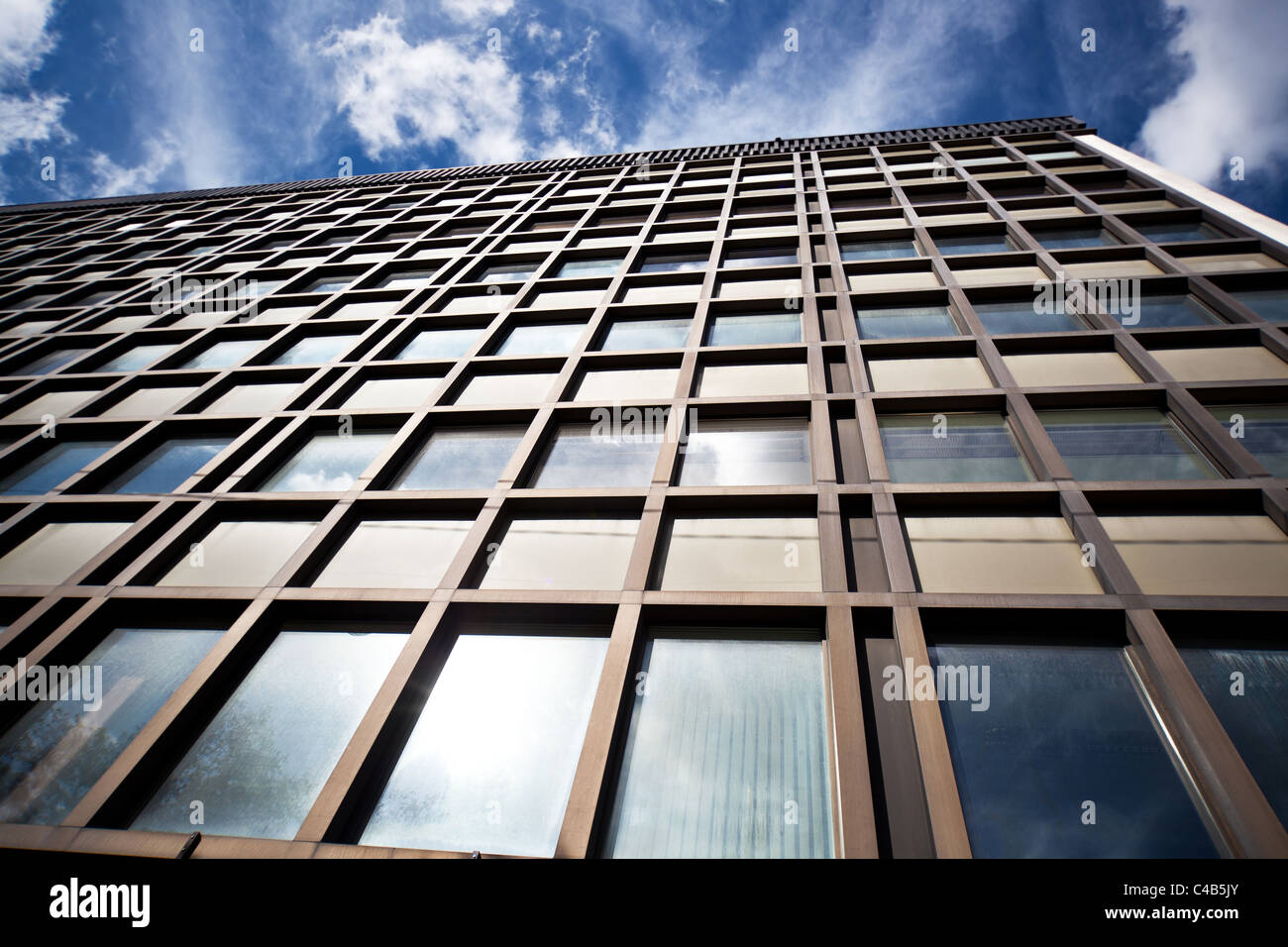 Modern business building on sky background Stock Photo - Alamy