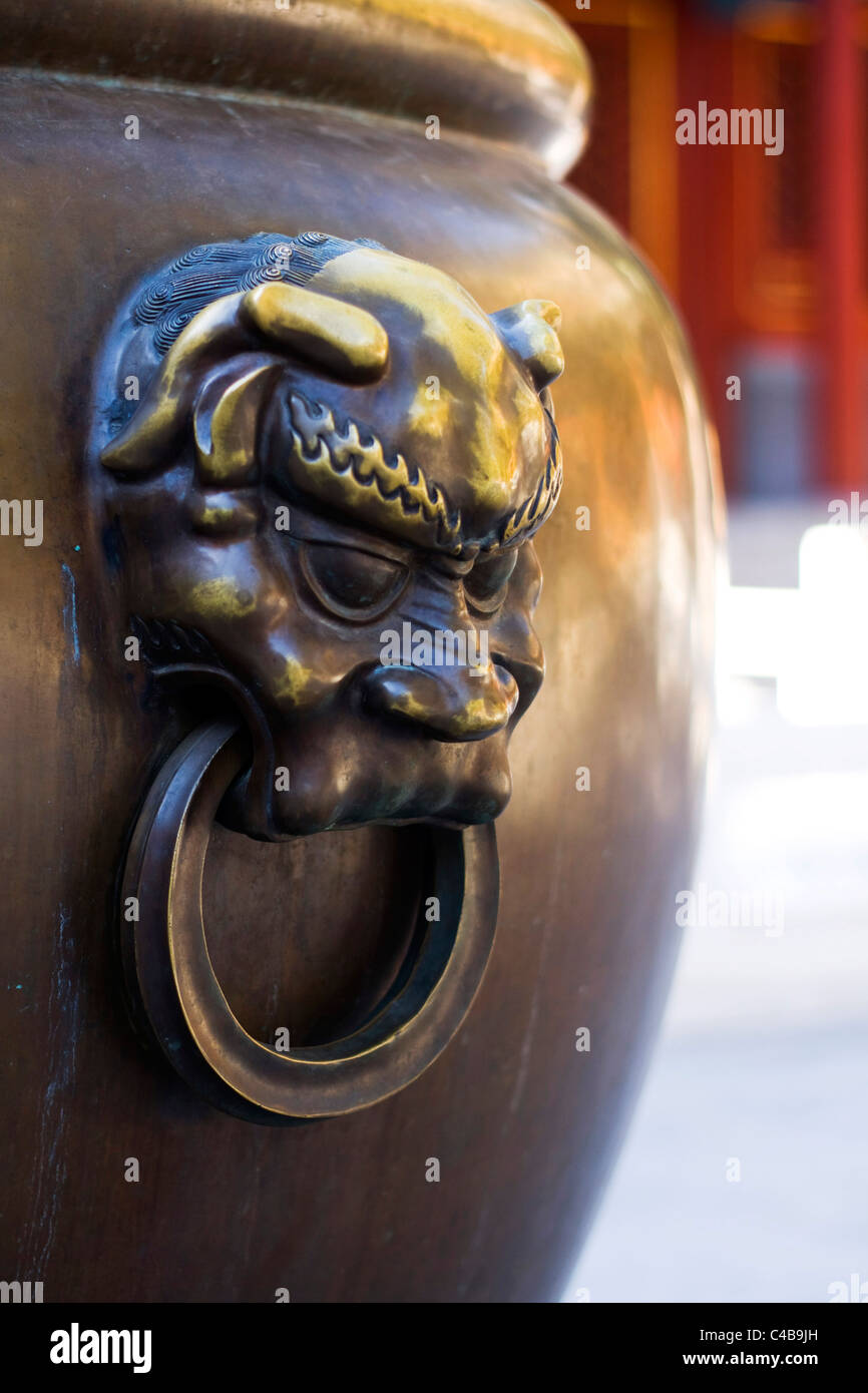 lion handle on a copper jar Stock Photo - Alamy