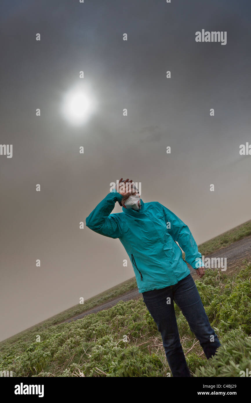 Woman wipes the ash from her eyes from Grimsvotn Volcanic Eruption in ...