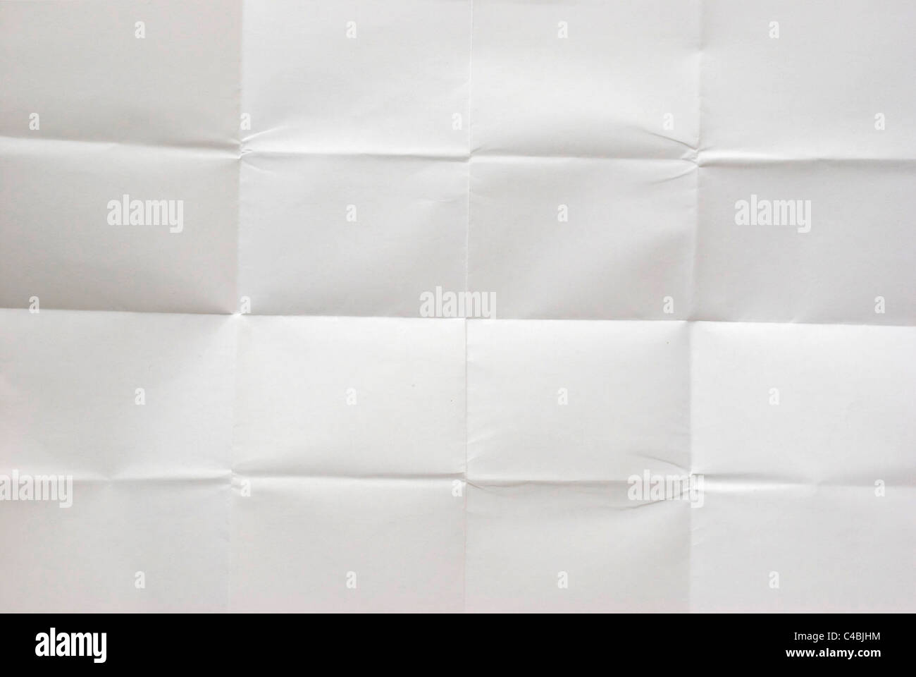 white sheet of paper folded into 16 pieces Stock Photo - Alamy