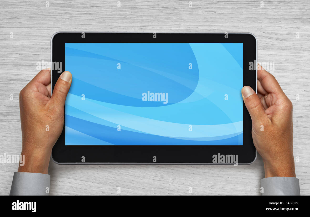 hands of businessman holding touchpad pc under table Stock Photo - Alamy