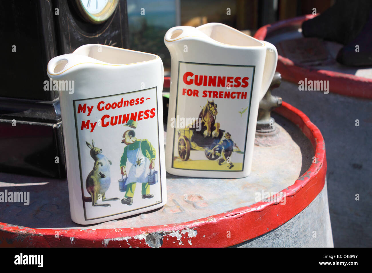Guinness branded jugs for sale on a market stall at a local fete ...
