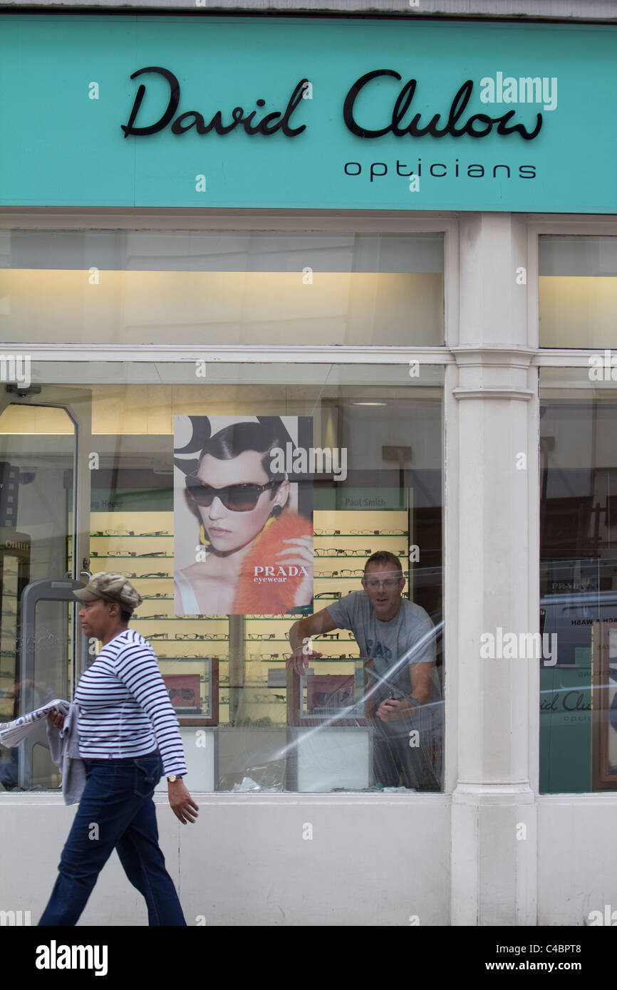 David Clulow optician branch with window cleaner cleaning display ...