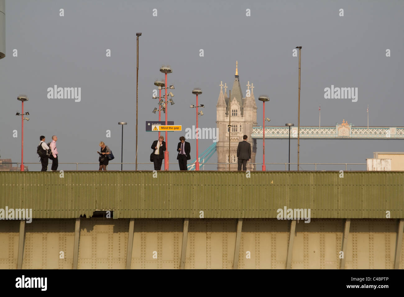 London commuters on platform at Cannon Street station Railway Bridge ...