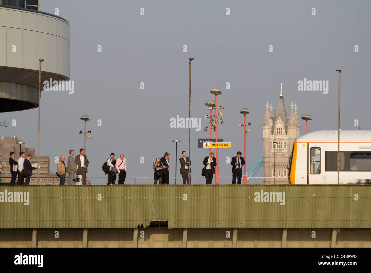 London commuters on platform at Cannon Street station Railway Bridge ...