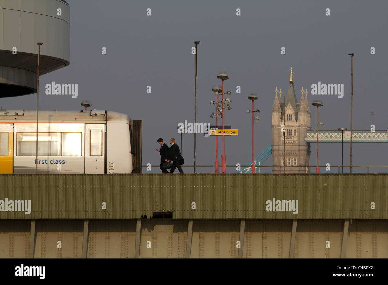 London commuters on platform at Cannon Street station Railway Bridge ...