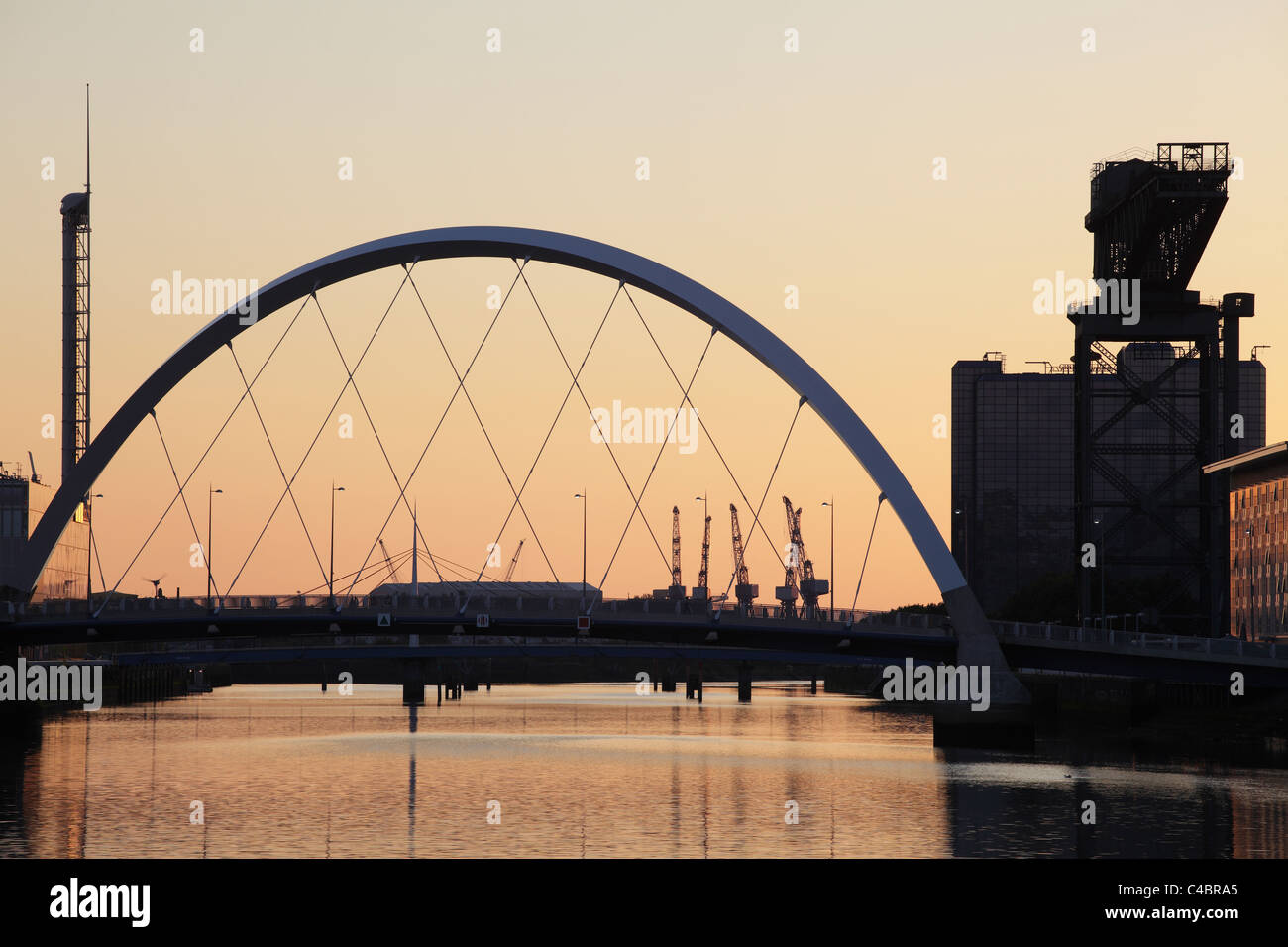 Clyde Arc Bridge Glasgow at sunset, looking west along the River Clyde ...