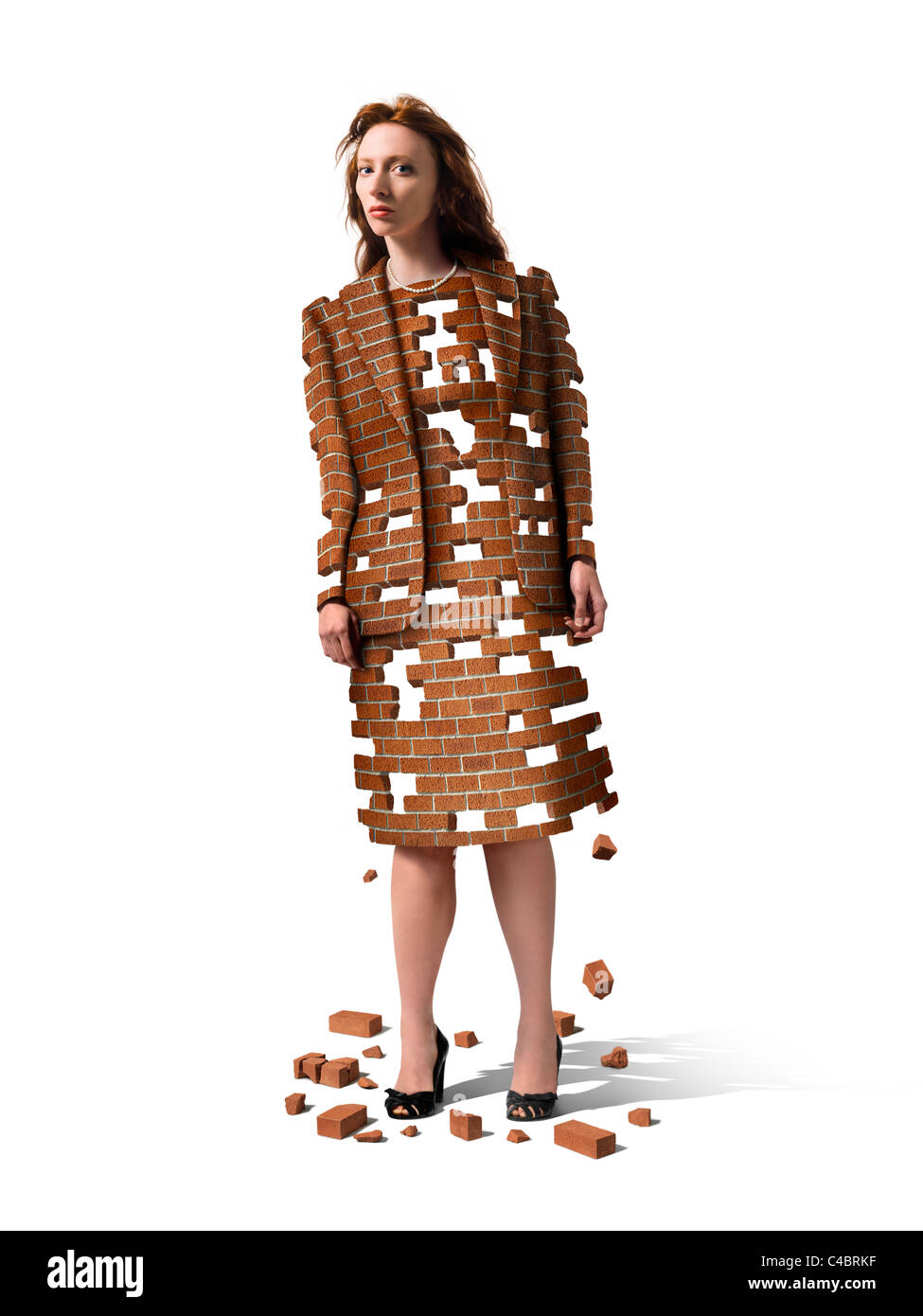woman made of bricks that are breaking apart seen against white ...