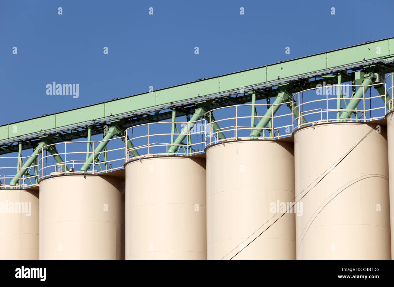 Industrial silo against the blue sky Stock Photo - Alamy