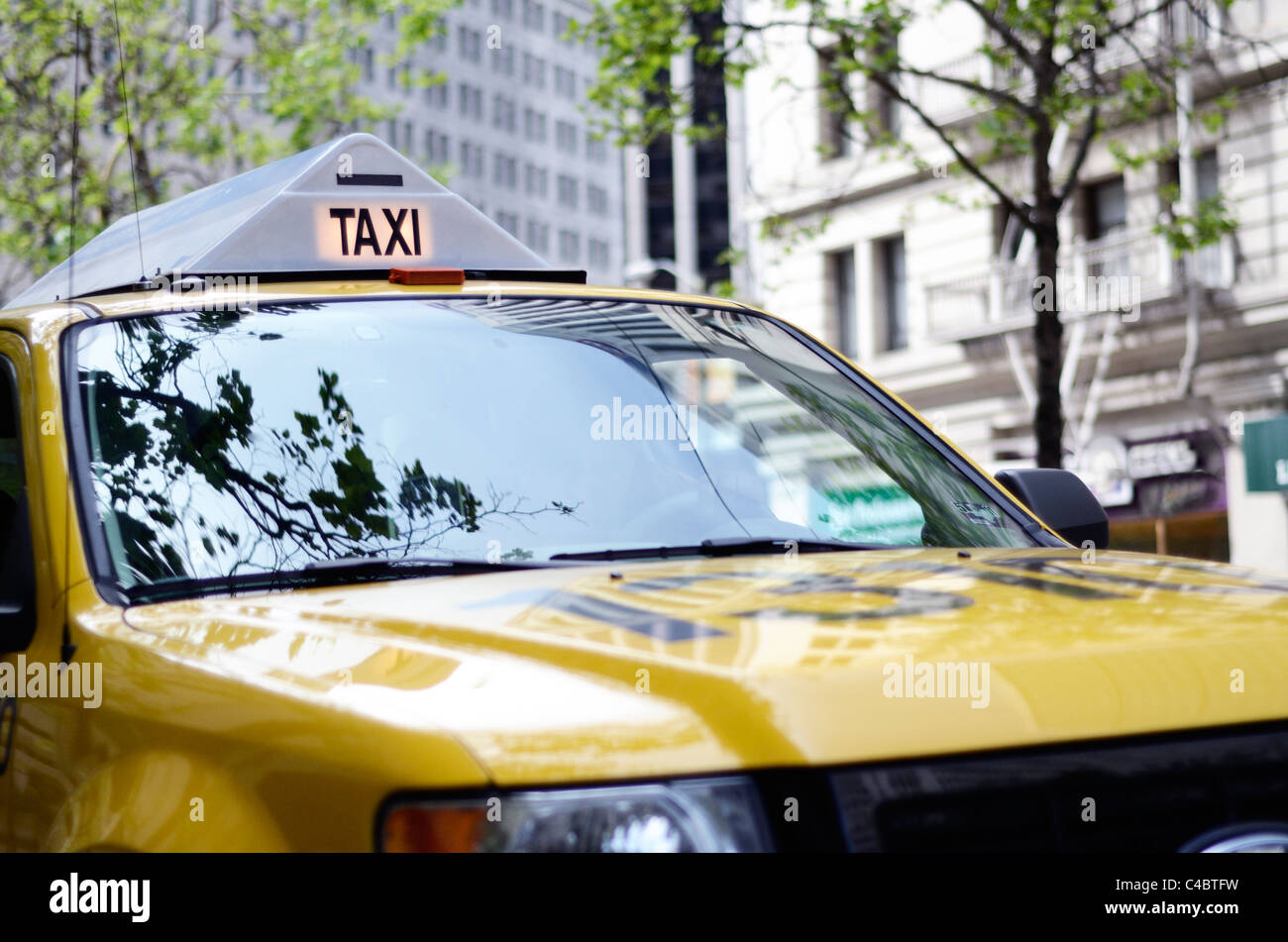Close up of yellow taxi cab with it's light illuminated Stock Photo - Alamy
