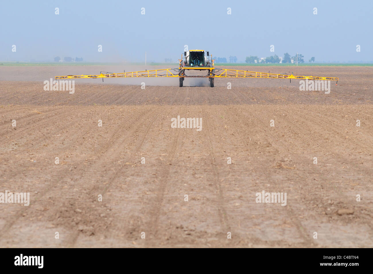 Self propelled crop sprayer spraying herbicide or insecticide on a pre ...