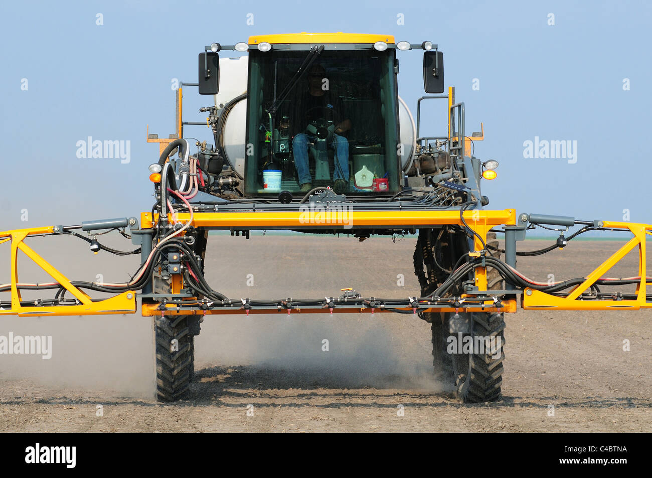 Self propelled crop sprayer spraying herbicide or insecticide on a pre ...