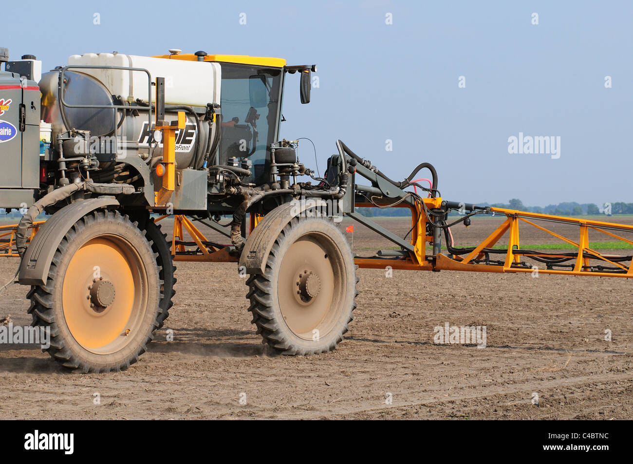 Self propelled crop sprayer spraying herbicide or insecticide on a pre ...