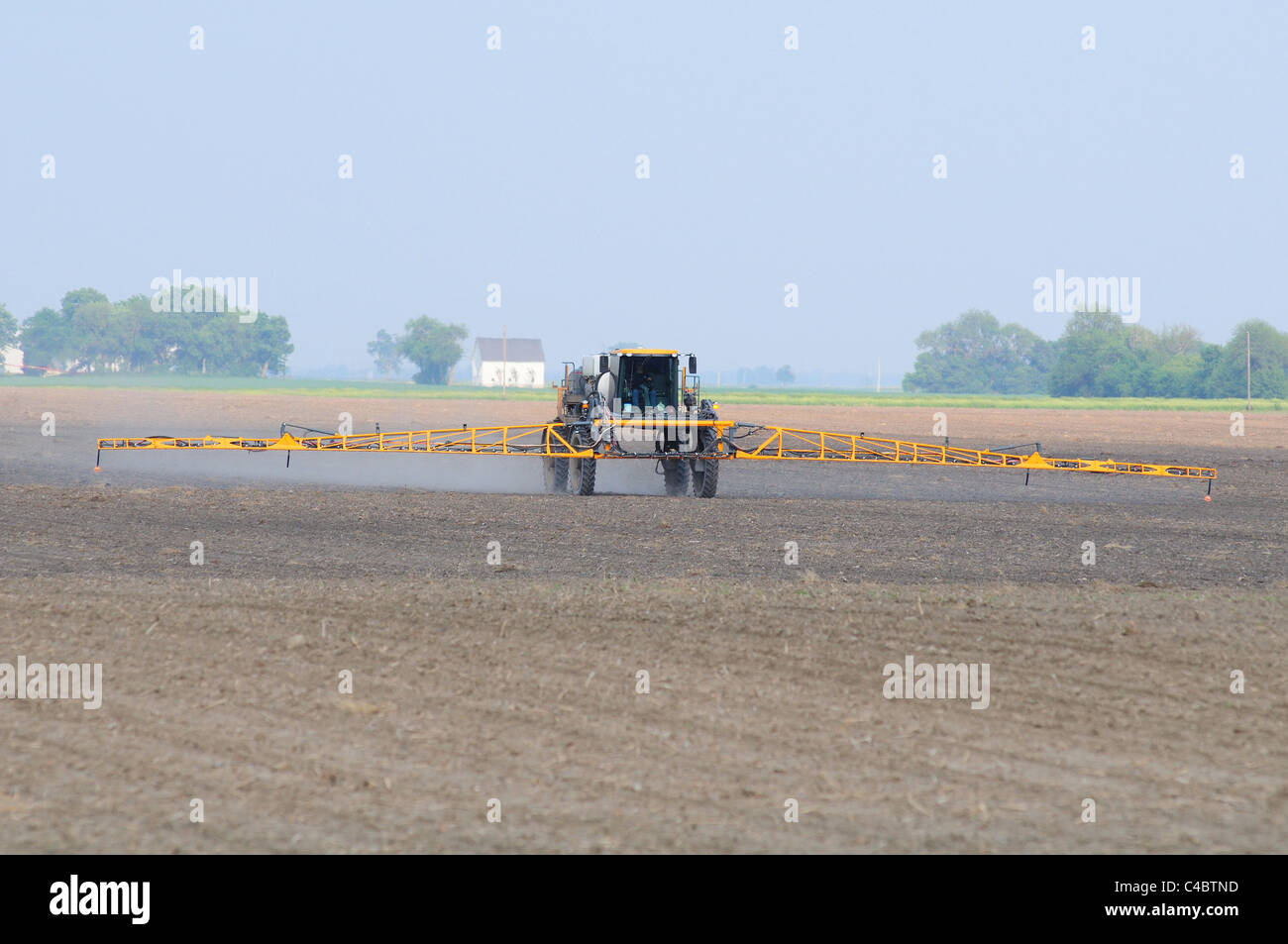 Self propelled crop sprayer spraying herbicide or insecticide on a pre ...