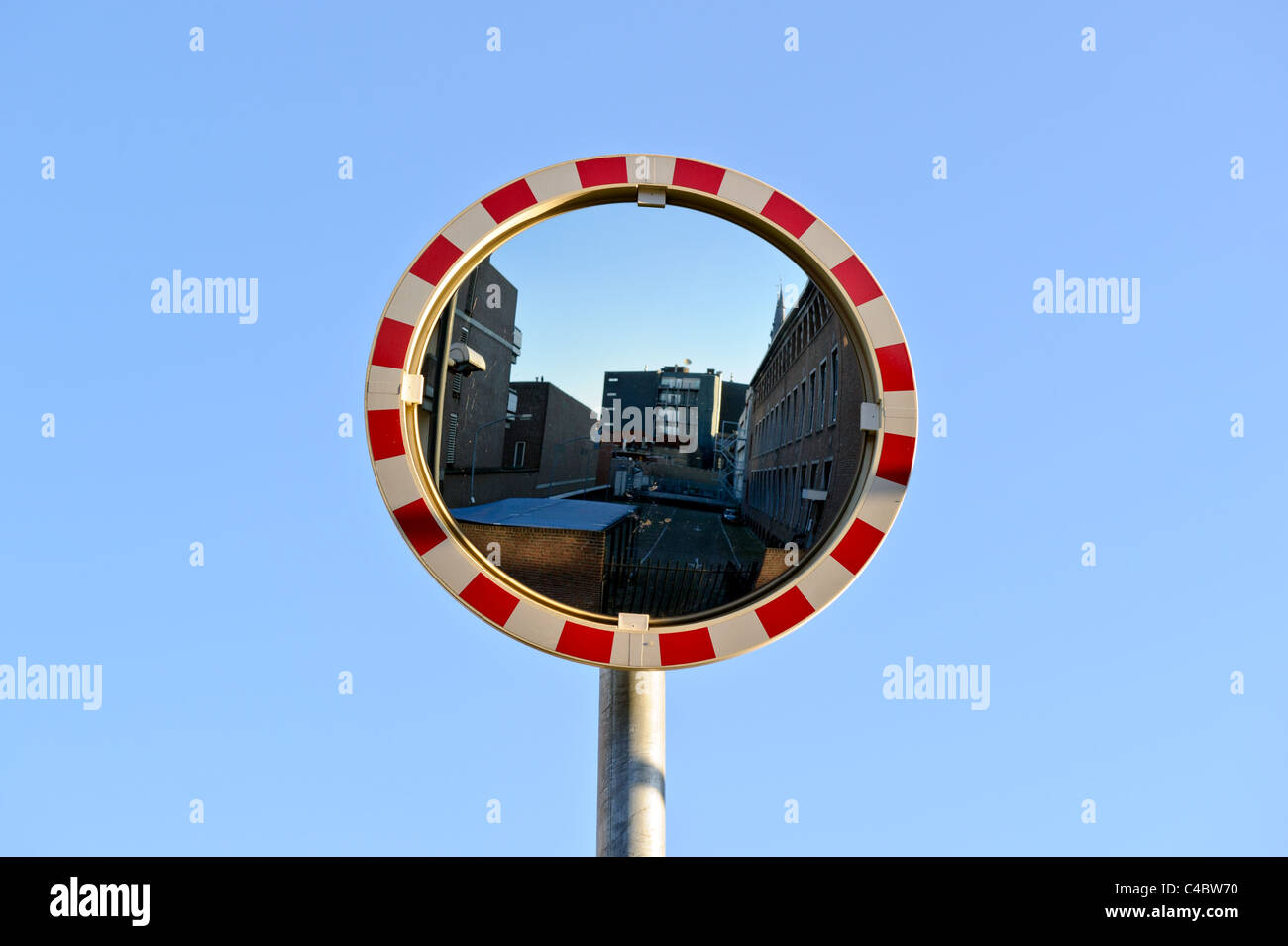 traffic mirror showing reflection of buildings Stock Photo - Alamy