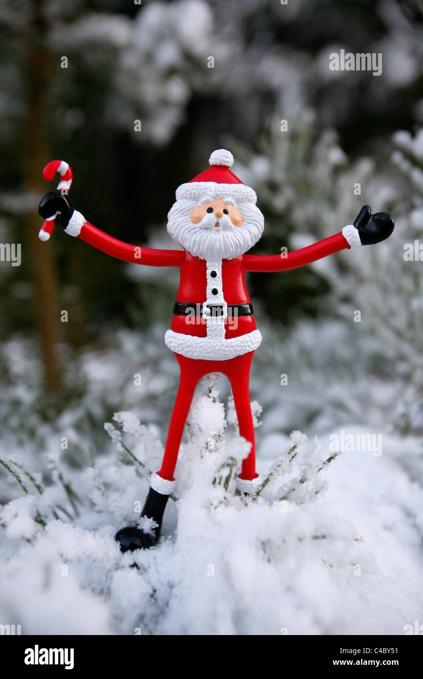 Funny Father Christmas toy in snow Stock Photo - Alamy