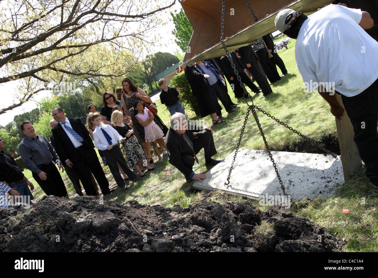 Filling in grave hi-res stock photography and images - Alamy