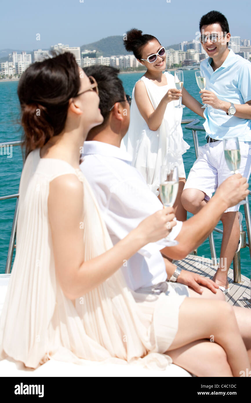 Friends Relaxing on a Yacht Stock Photo - Alamy