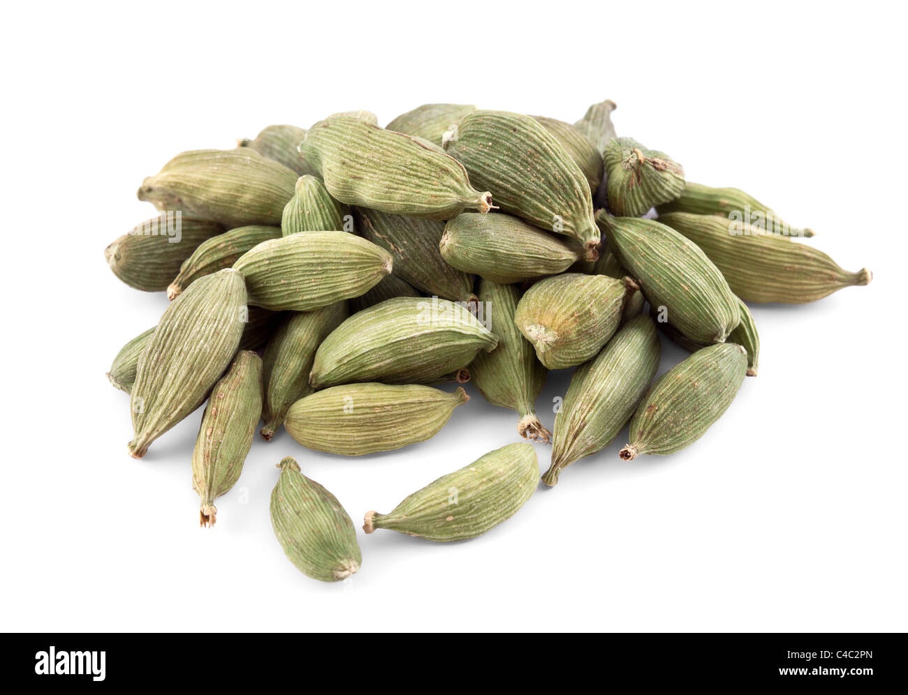 Cardamom seeds pile isolated on white background Stock Photo - Alamy