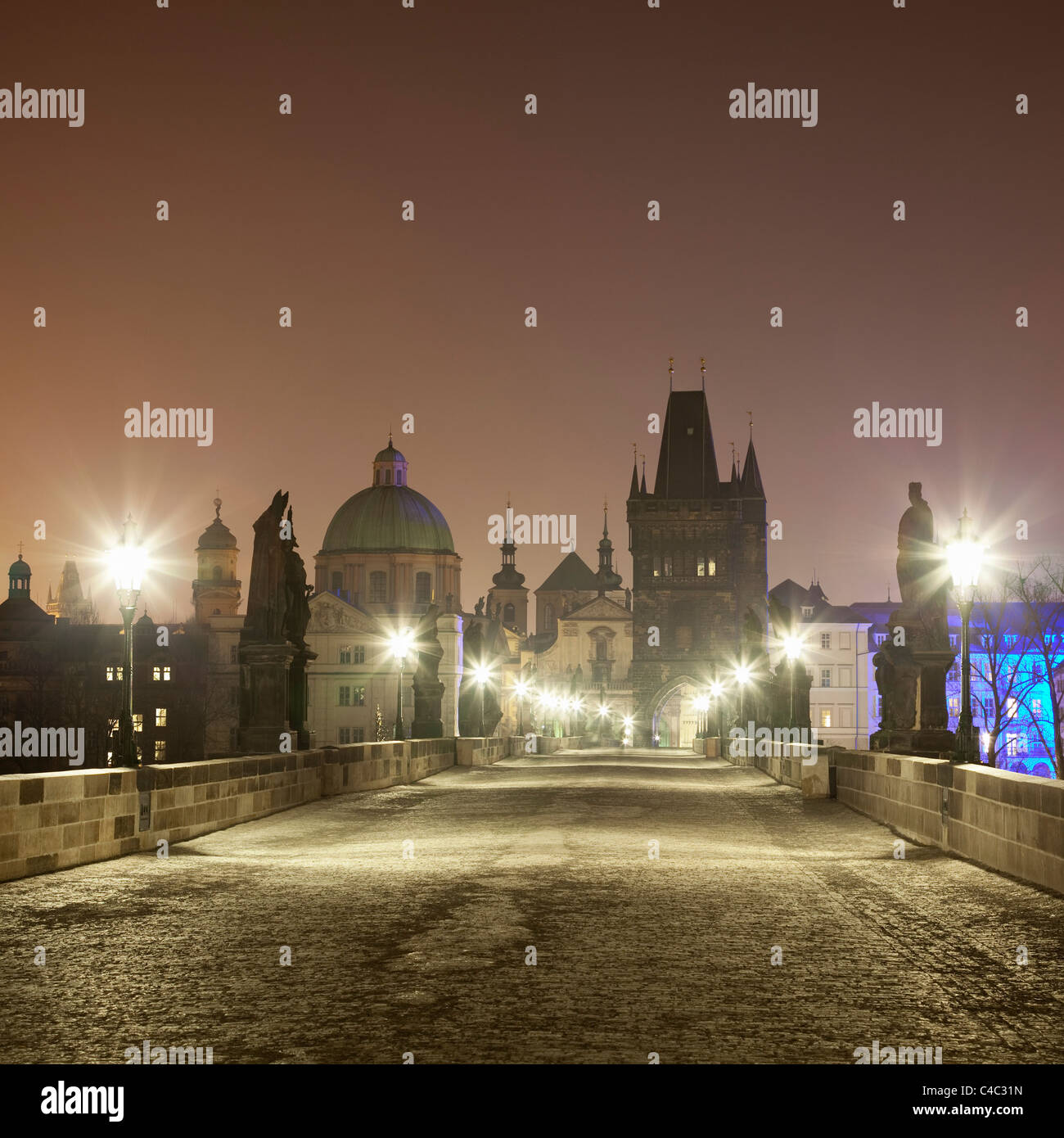 Buildings and bridge lit up at night Stock Photo - Alamy