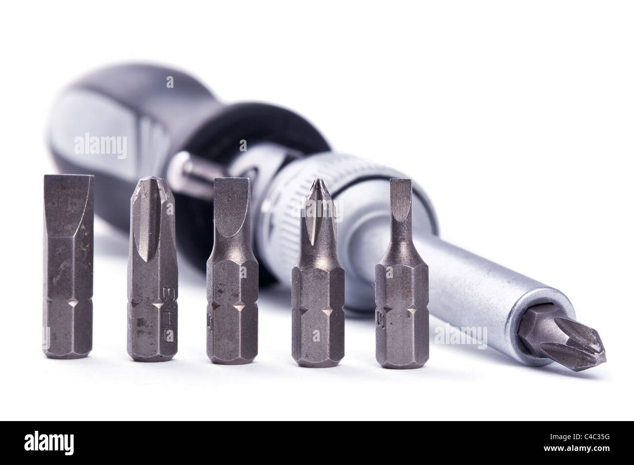 Screwdriver and removable bits isolated on white Stock Photo - Alamy