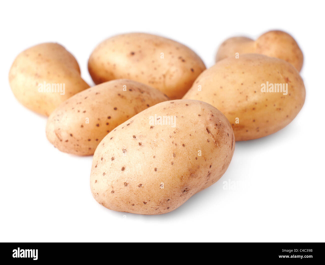 Few potatoes isolated in white background Stock Photo - Alamy