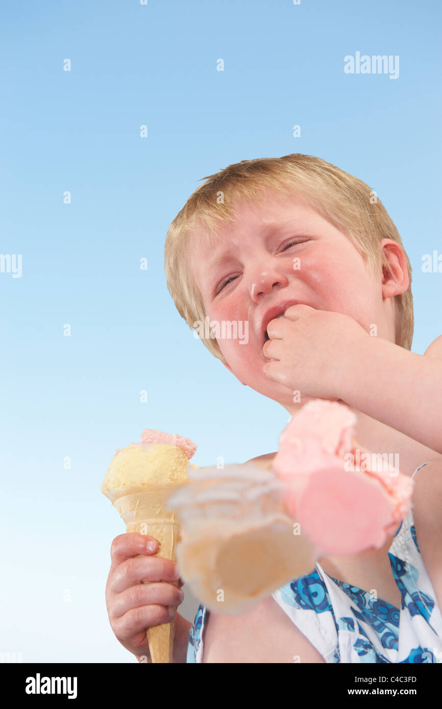 Crying boy with dropped ice cream Stock Photo - Alamy
